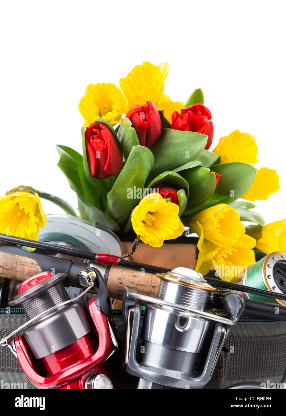 fishing tackles with spring flowers narcissus and tulips on white ...