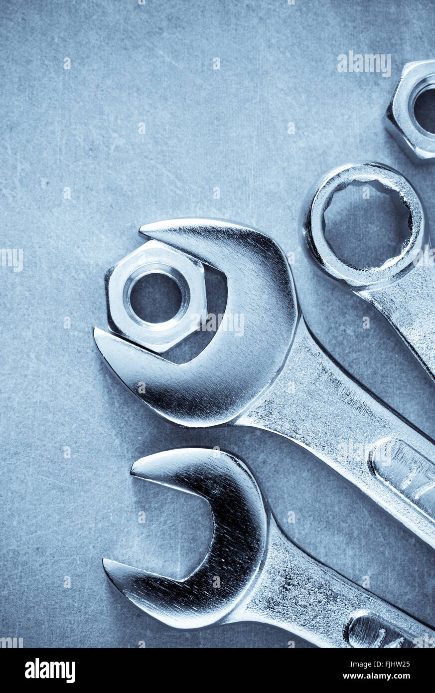 wrench tools at metal background Stock Photo - Alamy