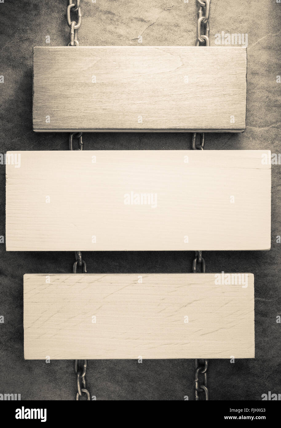 hanging signboard at wall background Stock Photo - Alamy