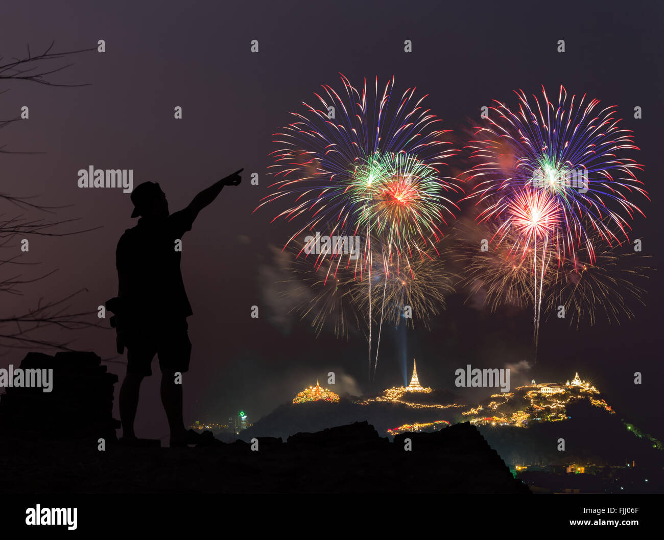 The man looks holiday fireworks in the evening sky Stock Photo - Alamy