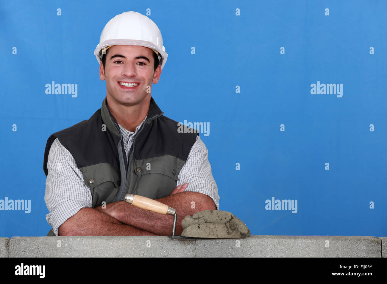 Mason proud of his work Stock Photo - Alamy