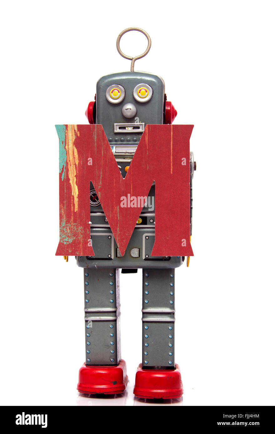 Vintage robot toys holding letters up Stock Photo - Alamy