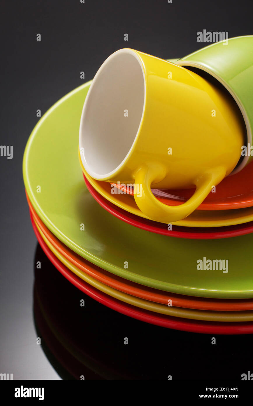 set of dishware on black background Stock Photo - Alamy