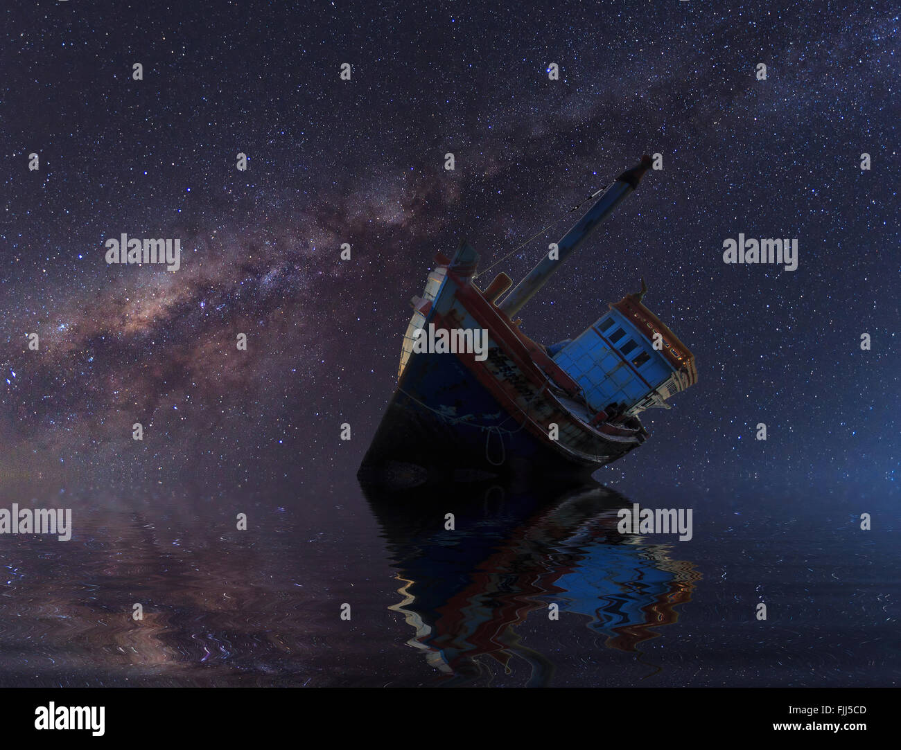 The wrecked ship under starry night with clearly milky way Stock Photo ...