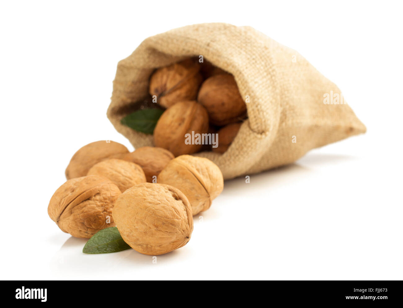 walnuts in bag isolated on white background Stock Photo - Alamy