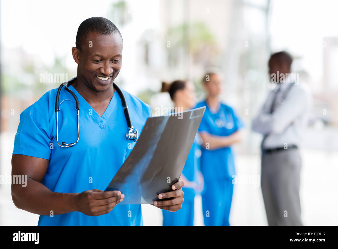 handsome African healthcare worker with x-ray Stock Photo - Alamy
