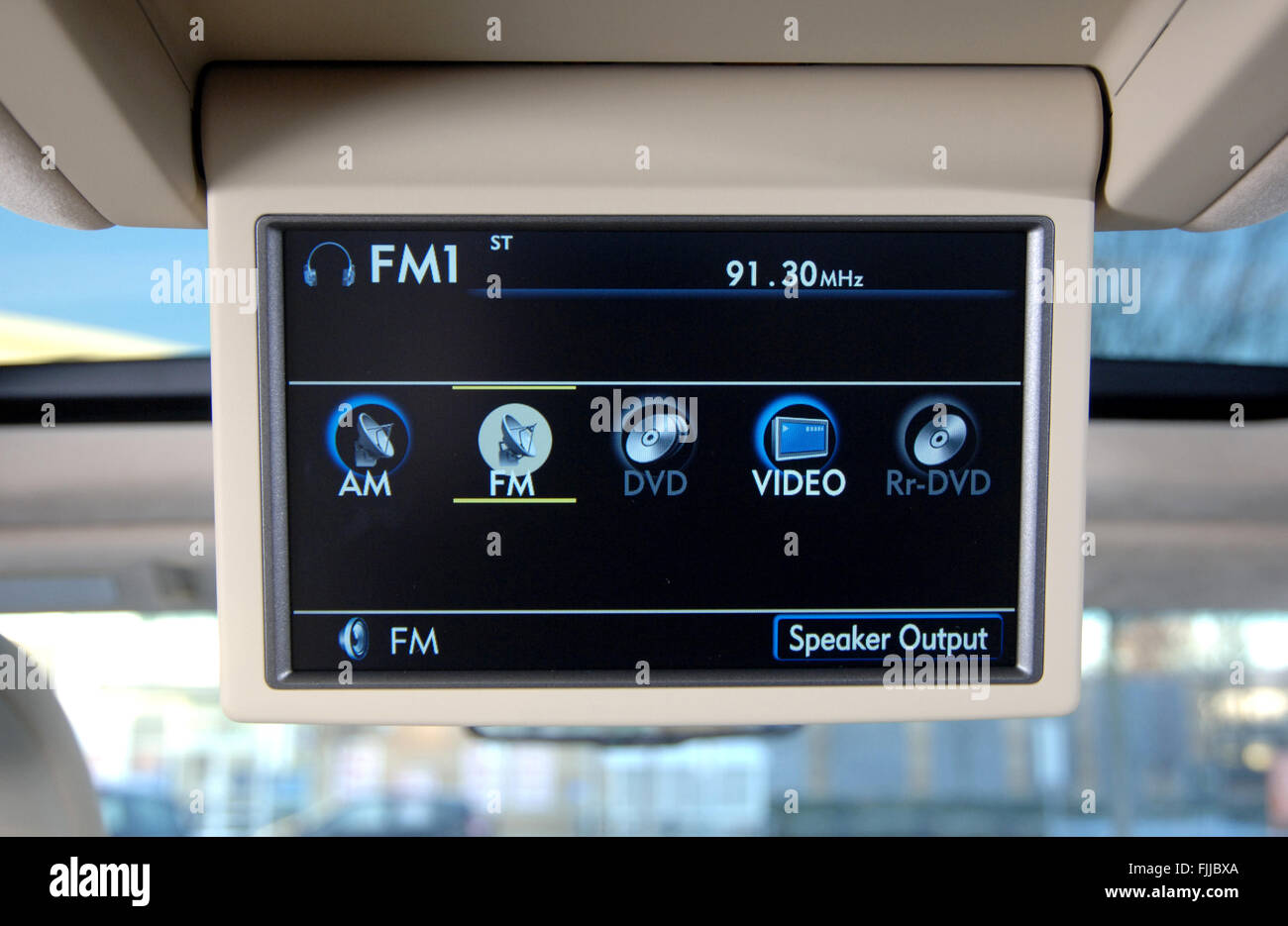 Drop down TV screen in the roof of a luxury car Stock Photo - Alamy