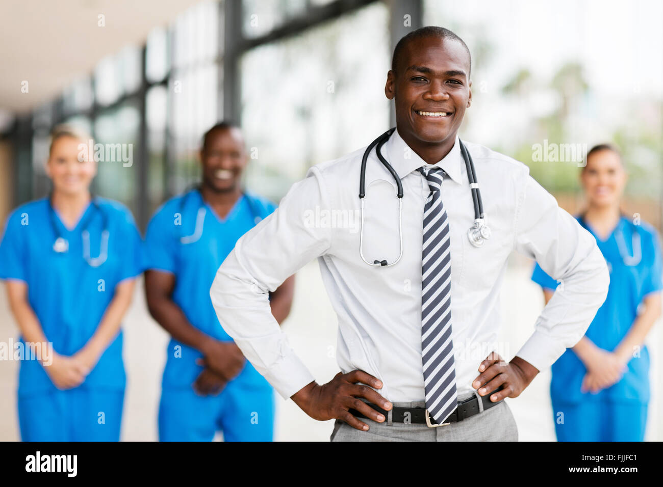 handsome African American medical doctor with colleagues in background ...