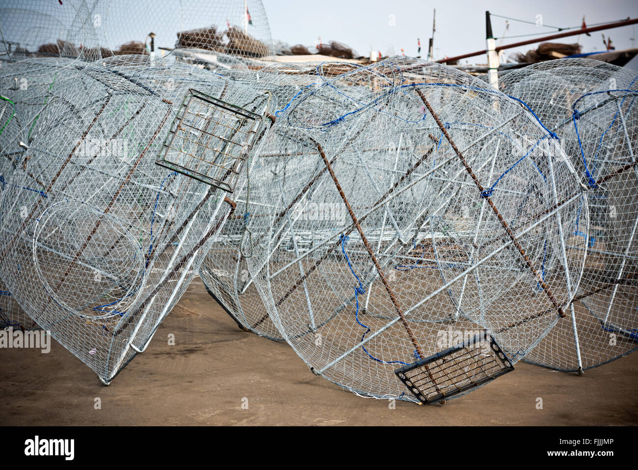 Metal fishing nets in a port. Horizontal shot Stock Photo - Alamy