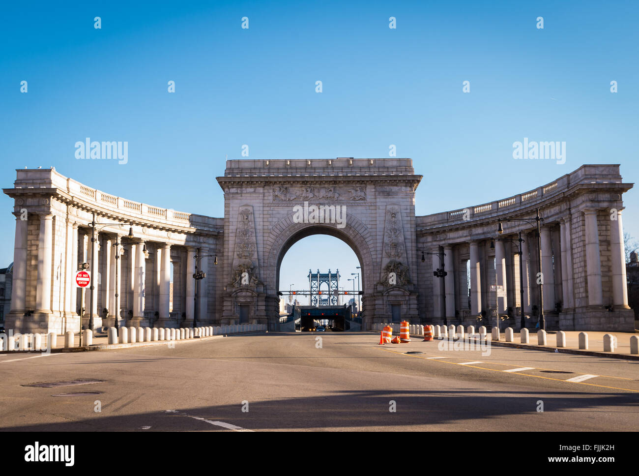 The entrance to the Manhattan Bridge East River crossing is an arch and ...