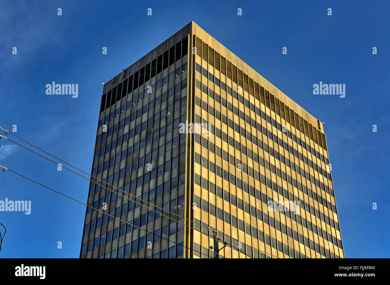 Random Building against a blue sky Stock Photo - Alamy