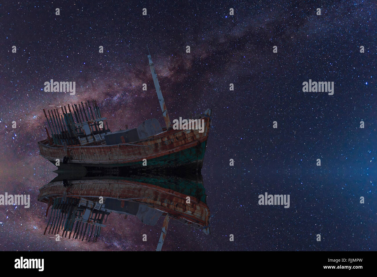 The wrecked ship under starry night with clearly milky way Stock Photo ...