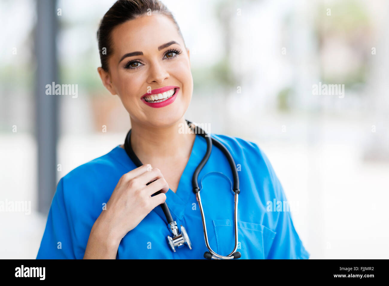 pretty female healthcare worker closeup portrait in office Stock Photo ...