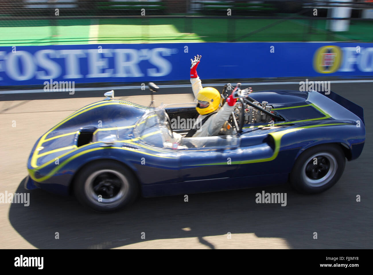 McLaren M1 historic racing car winning driver coming into the pits ...