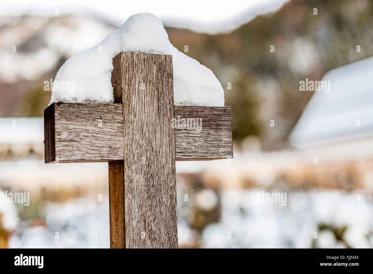 standing wooden cross covered by snow Stock Photo - Alamy