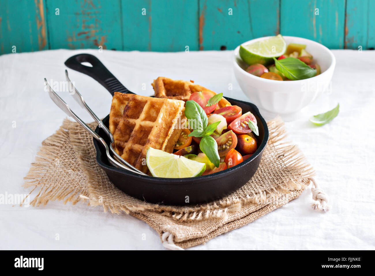 Savory cheese waffles with tomato salsa Stock Photo - Alamy