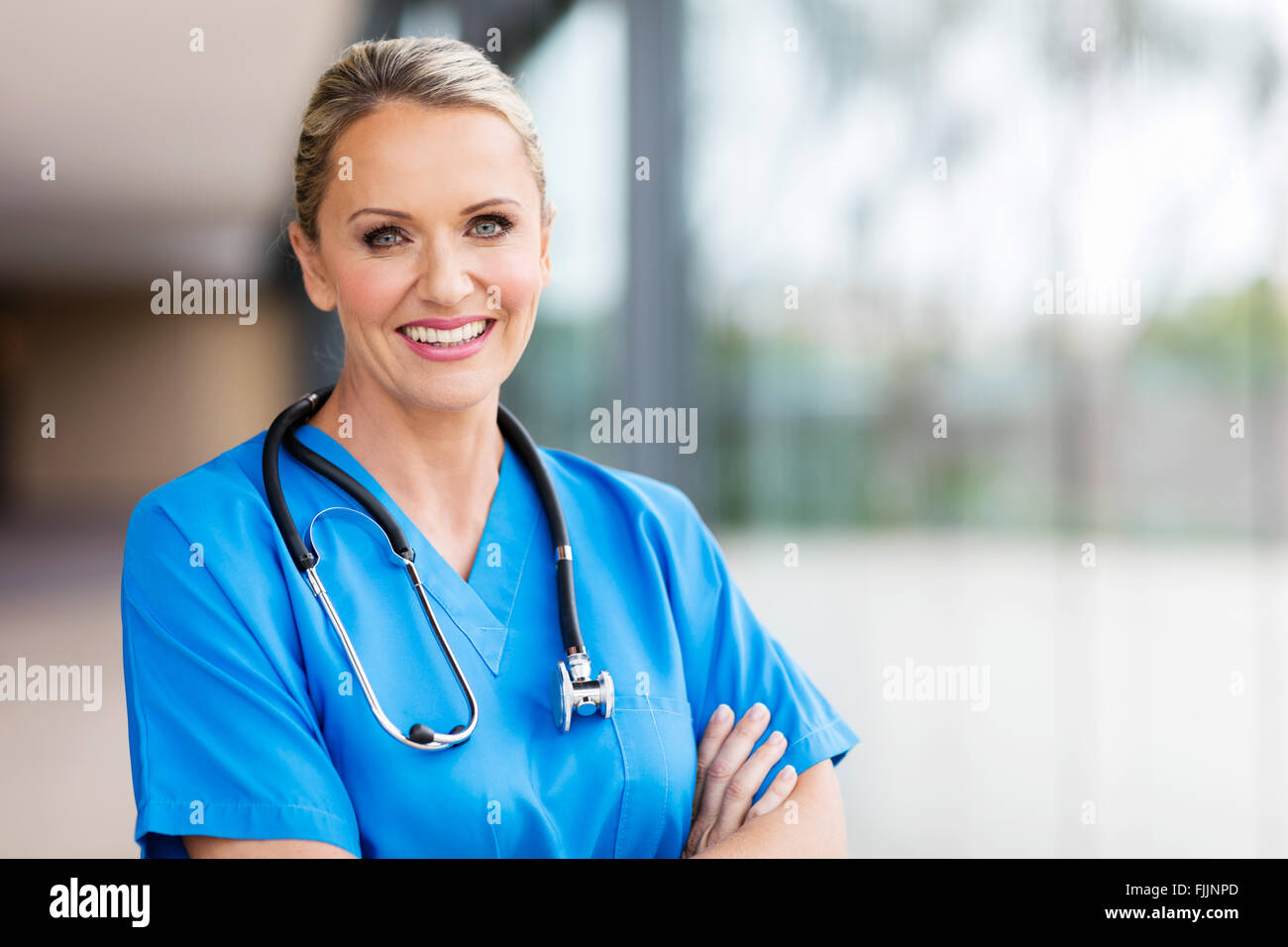 portrait of pretty female healthcare worker in office Stock Photo - Alamy