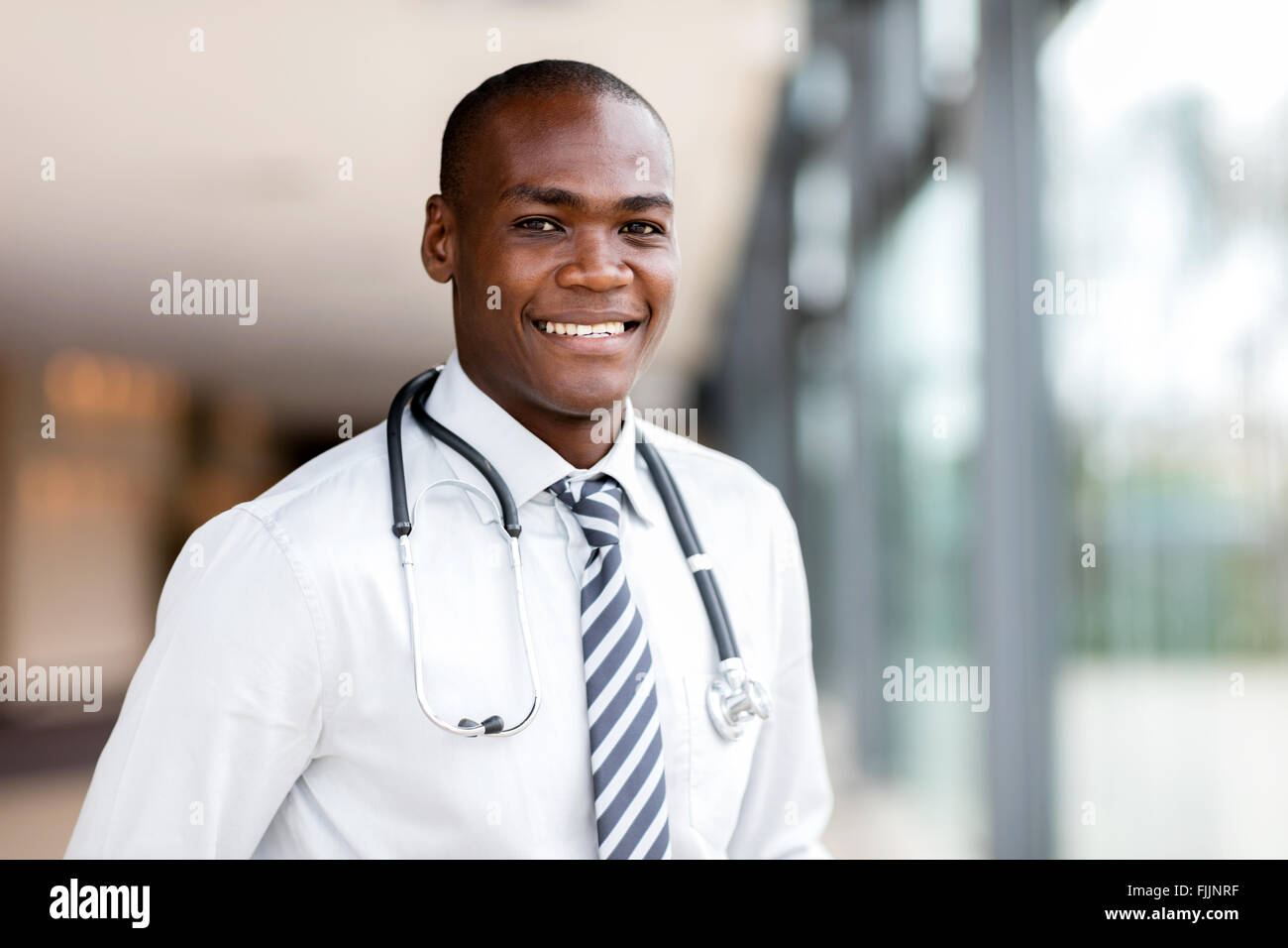 cheerful young African medical doctor at hospital Stock Photo - Alamy