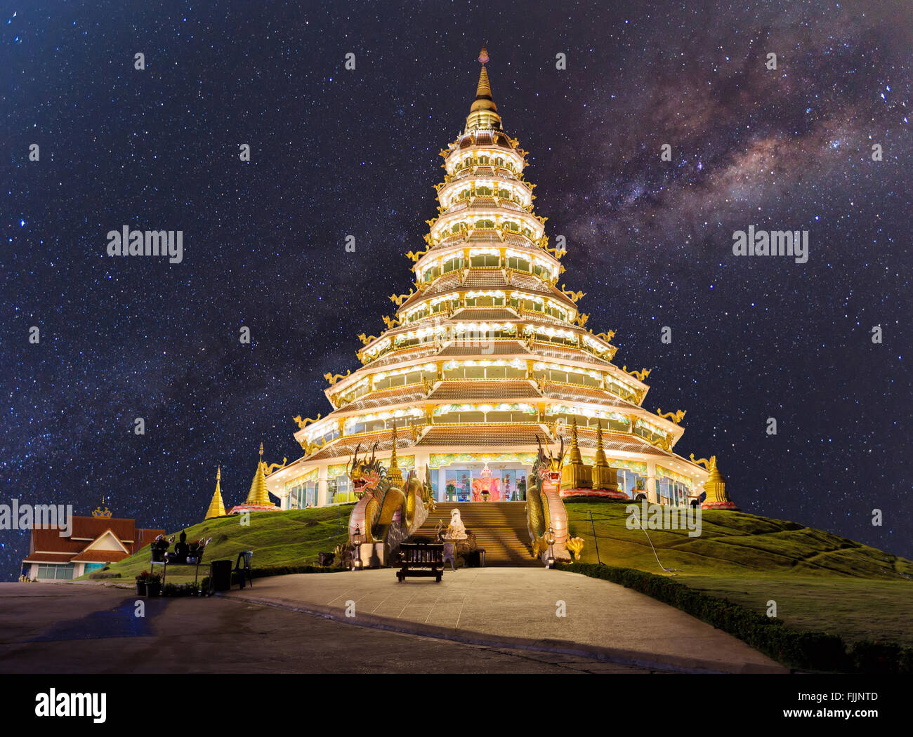 The beauty of the Emerald Buddha Temple at Milky way galaxy with stars ...