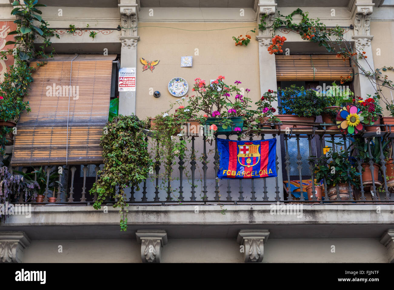 Flag on the balcony of apartment house in Barcelona, Spain Stock Photo ...