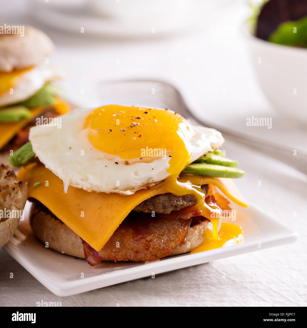 Breakfast burger with avocado, cheese and bacon Stock Photo - Alamy