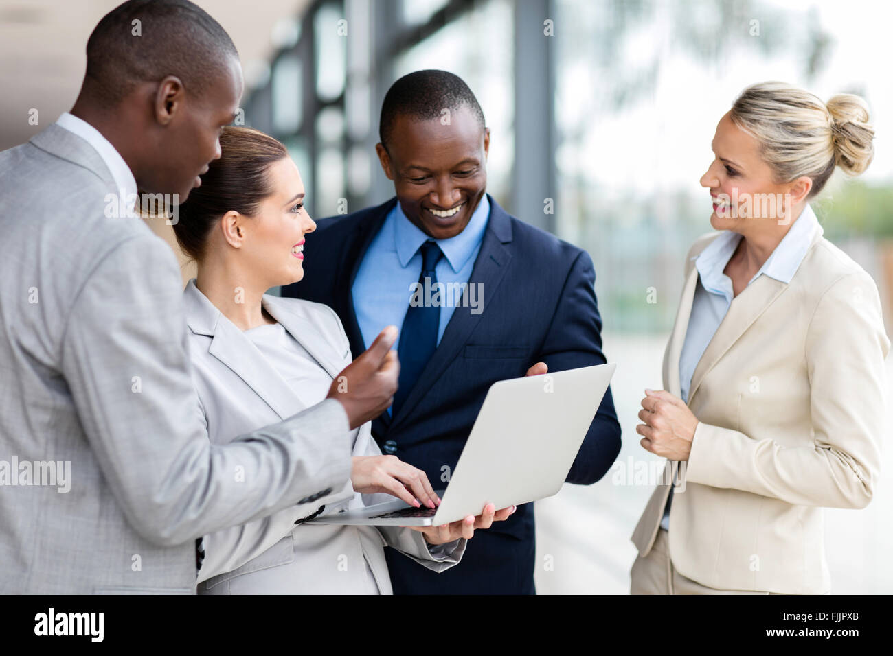 modern business group using laptop computer in office Stock Photo - Alamy