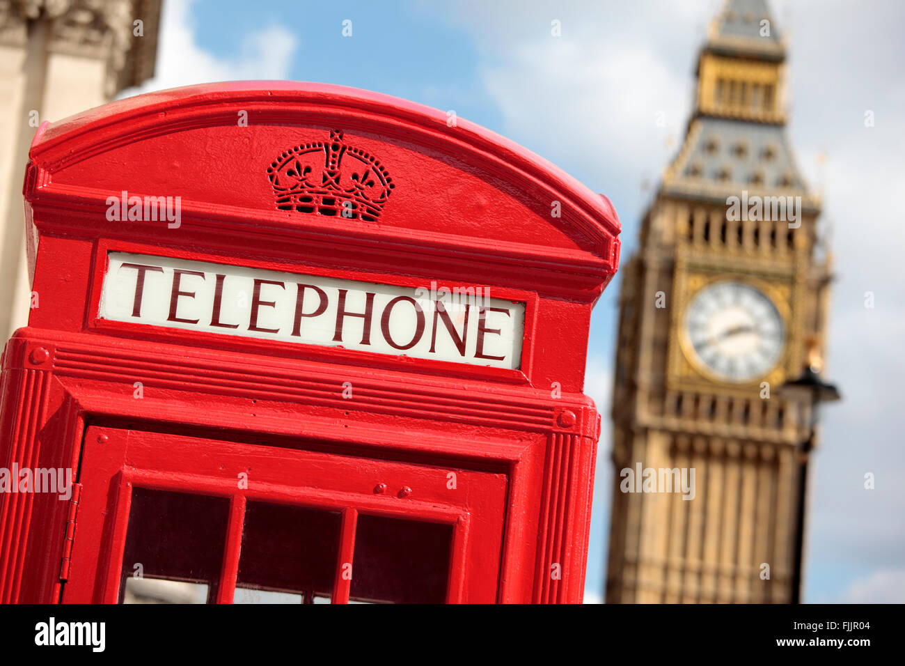 Traditional red telephone box with Big Ben out of focus in the ...