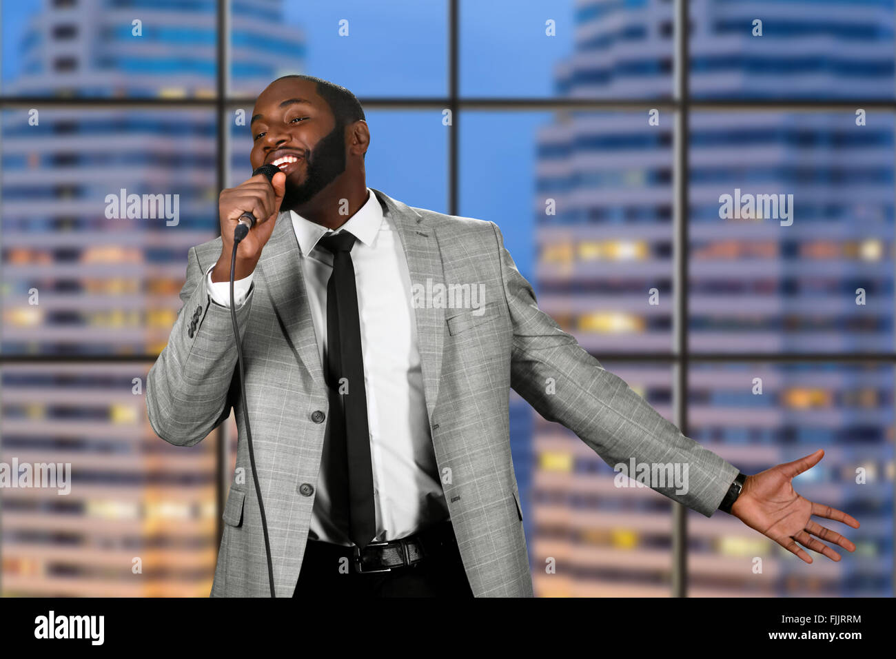 Evening live performance on television. Afroamerican singer performing ...