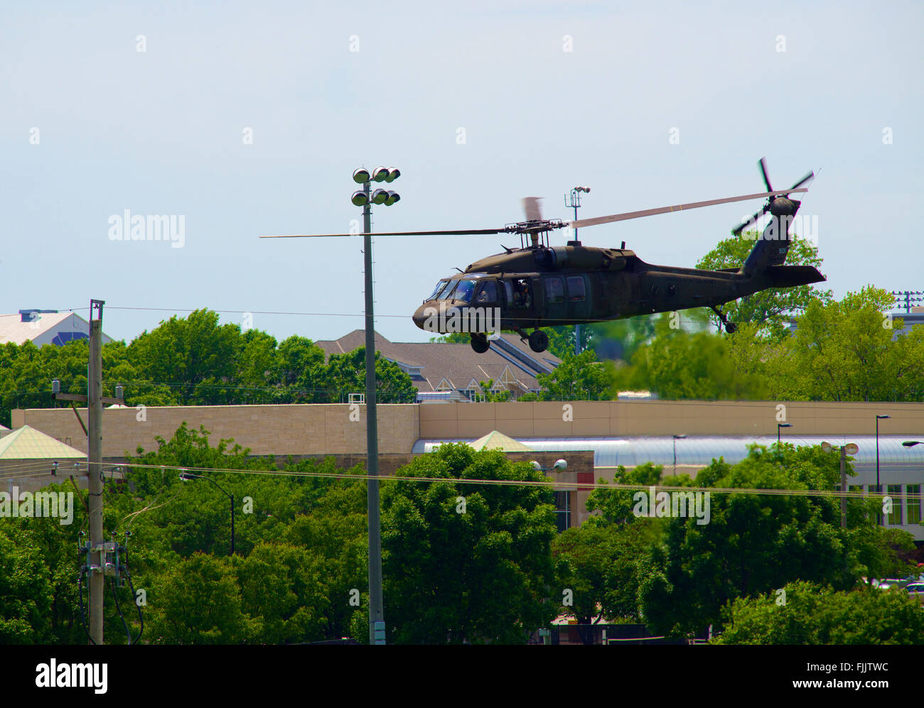 Manhattan, Kansas. 5-27-2015 Blackhawk helicopters from Fort RIley land ...