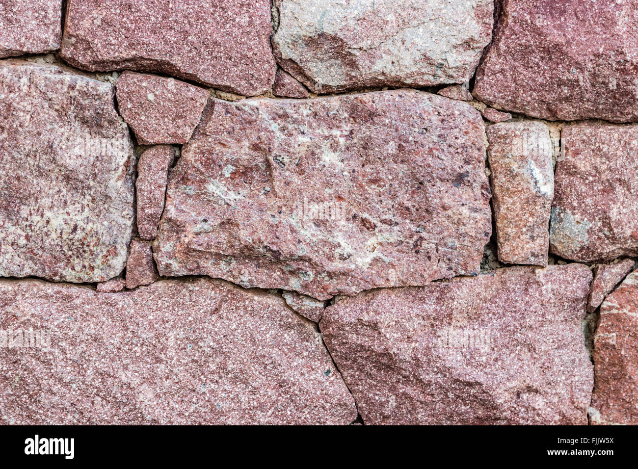 wall of reddish stones Stock Photo - Alamy