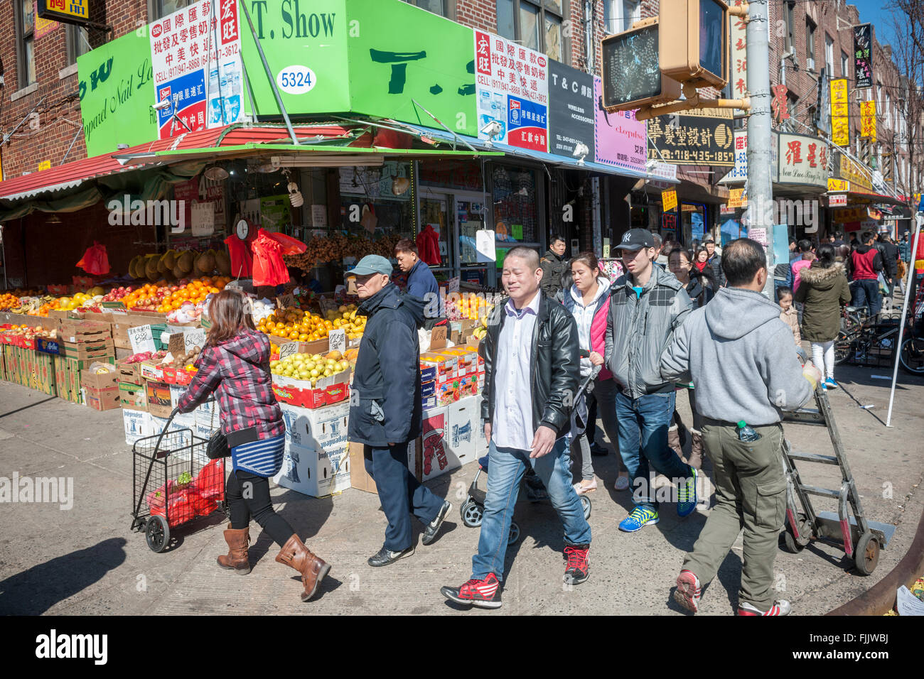 Thousands of people on Eighth Avenue in the Sunset Park neighborhood in Brooklyn in New York on ...