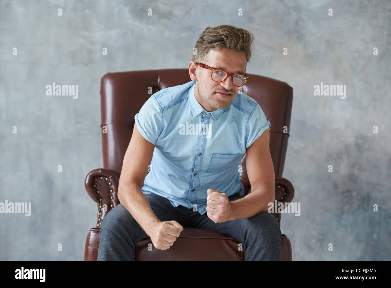 Portrait of a stylish intelligent man stares into the camera, small ...