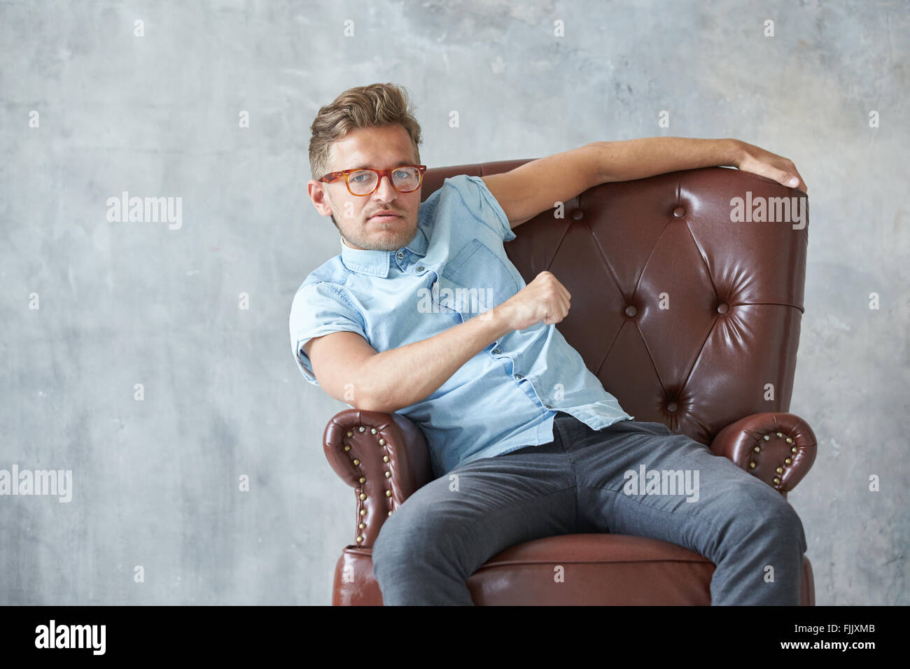 Portrait of a stylish intelligent man stares into the camera, small ...