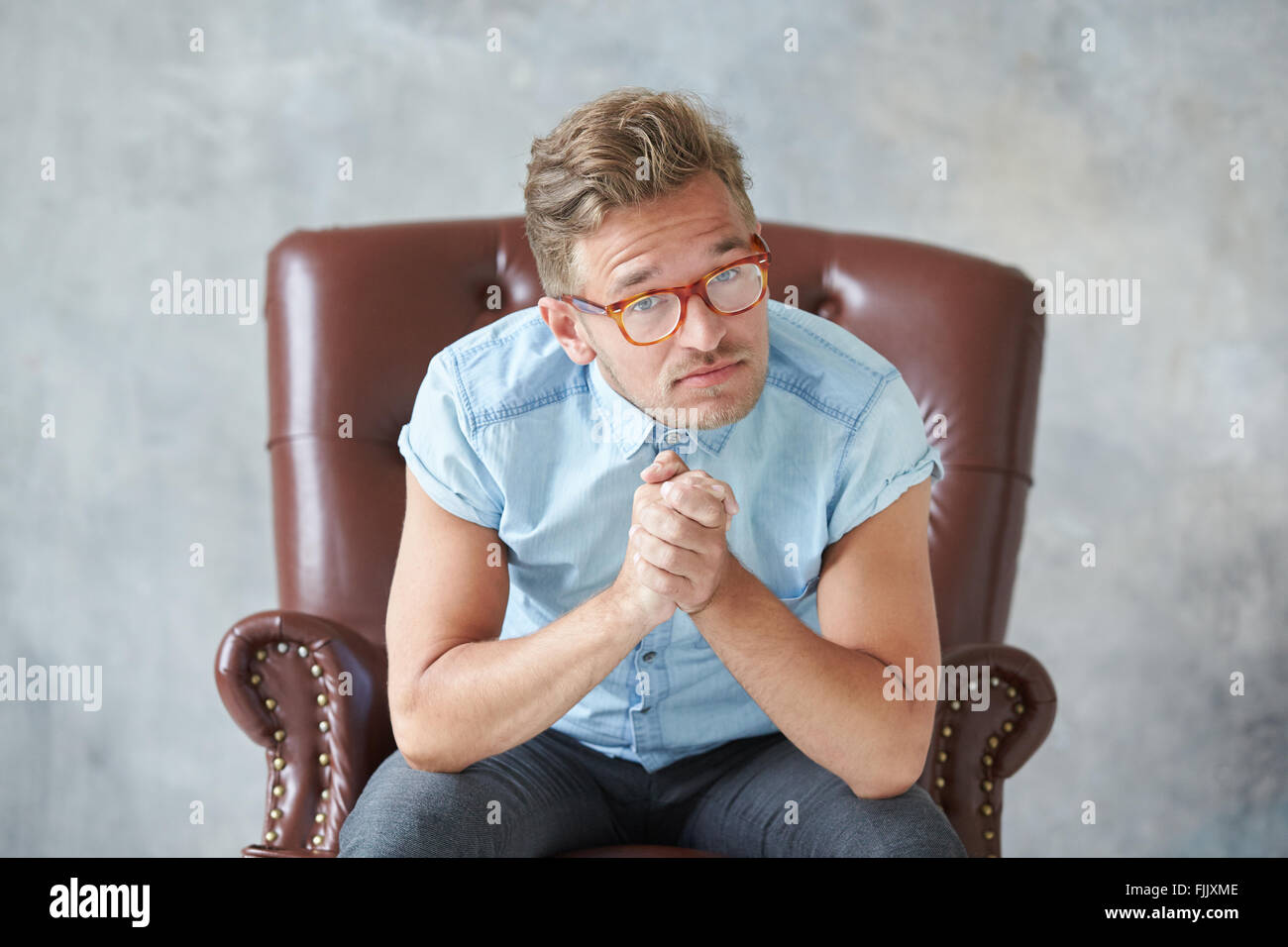 Portrait of a stylish intelligent man stares into the camera, small ...