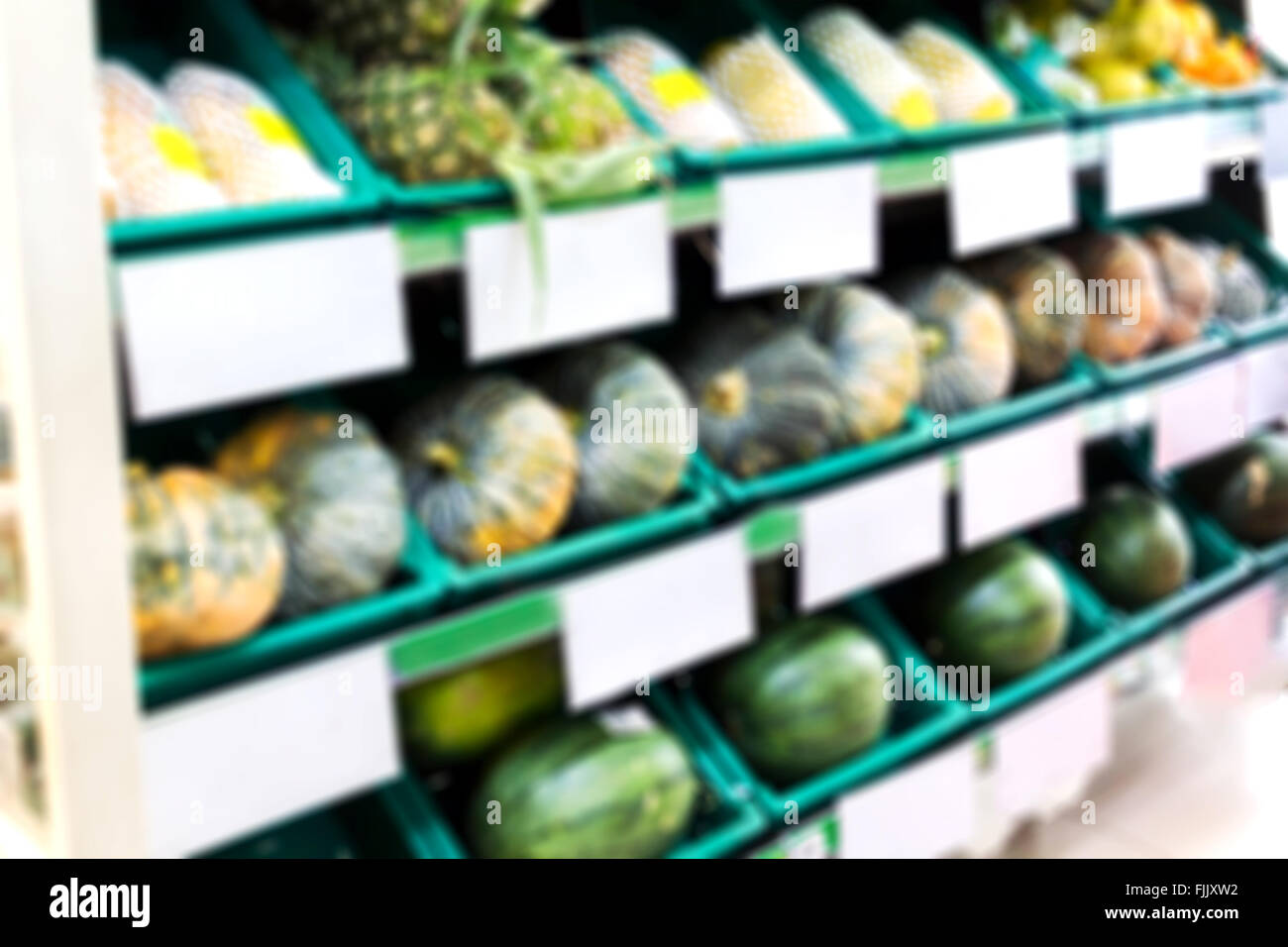 Blurred background fruits shelf in supermarket Stock Photo - Alamy