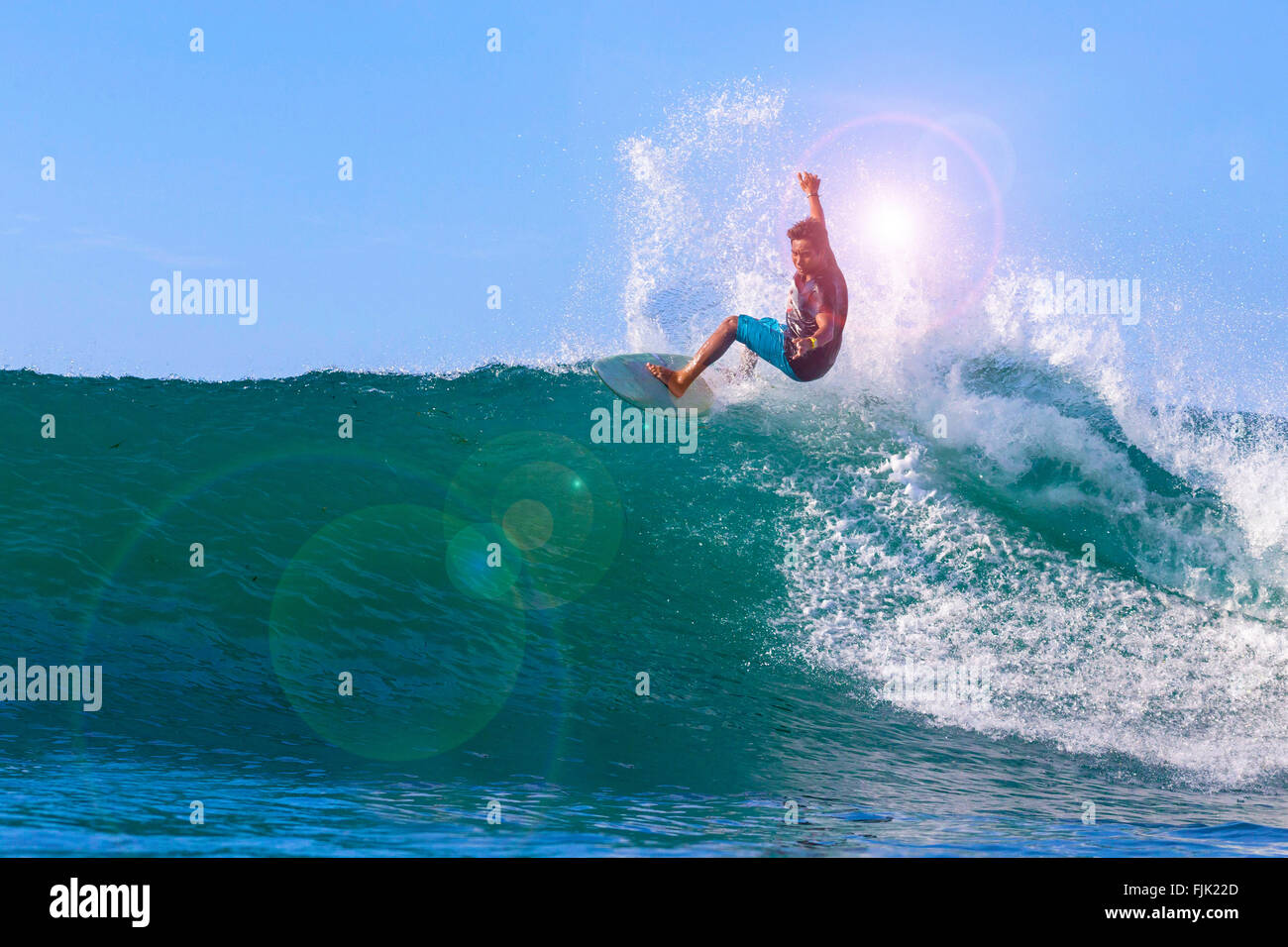 Surfer on a wave Stock Photo - Alamy