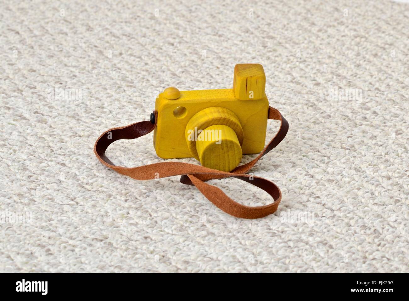 Wooden yellow toy camera Stock Photo - Alamy