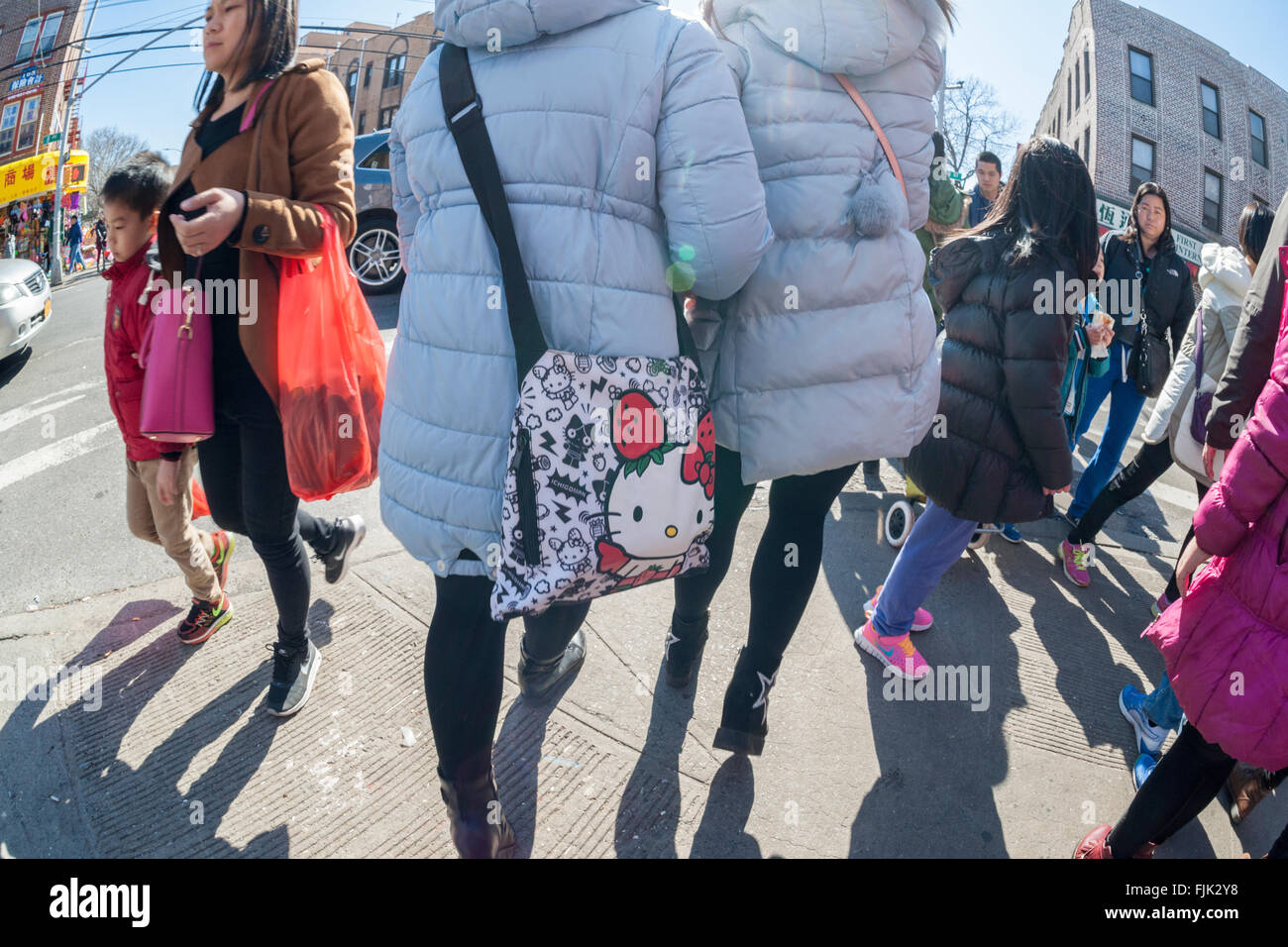 Woman with a Hello Kitty handbag on Eighth Avenue in the Sunset Park neighborhood in Brooklyn in ...