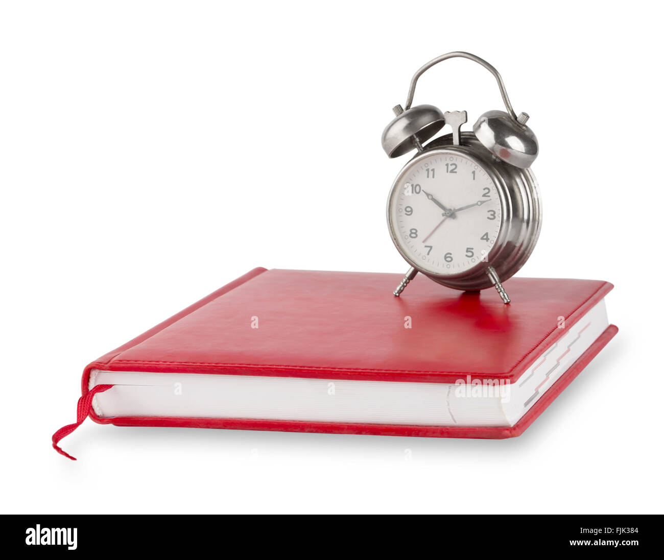 Red diary and old alarm clock isolated on white background Stock Photo ...