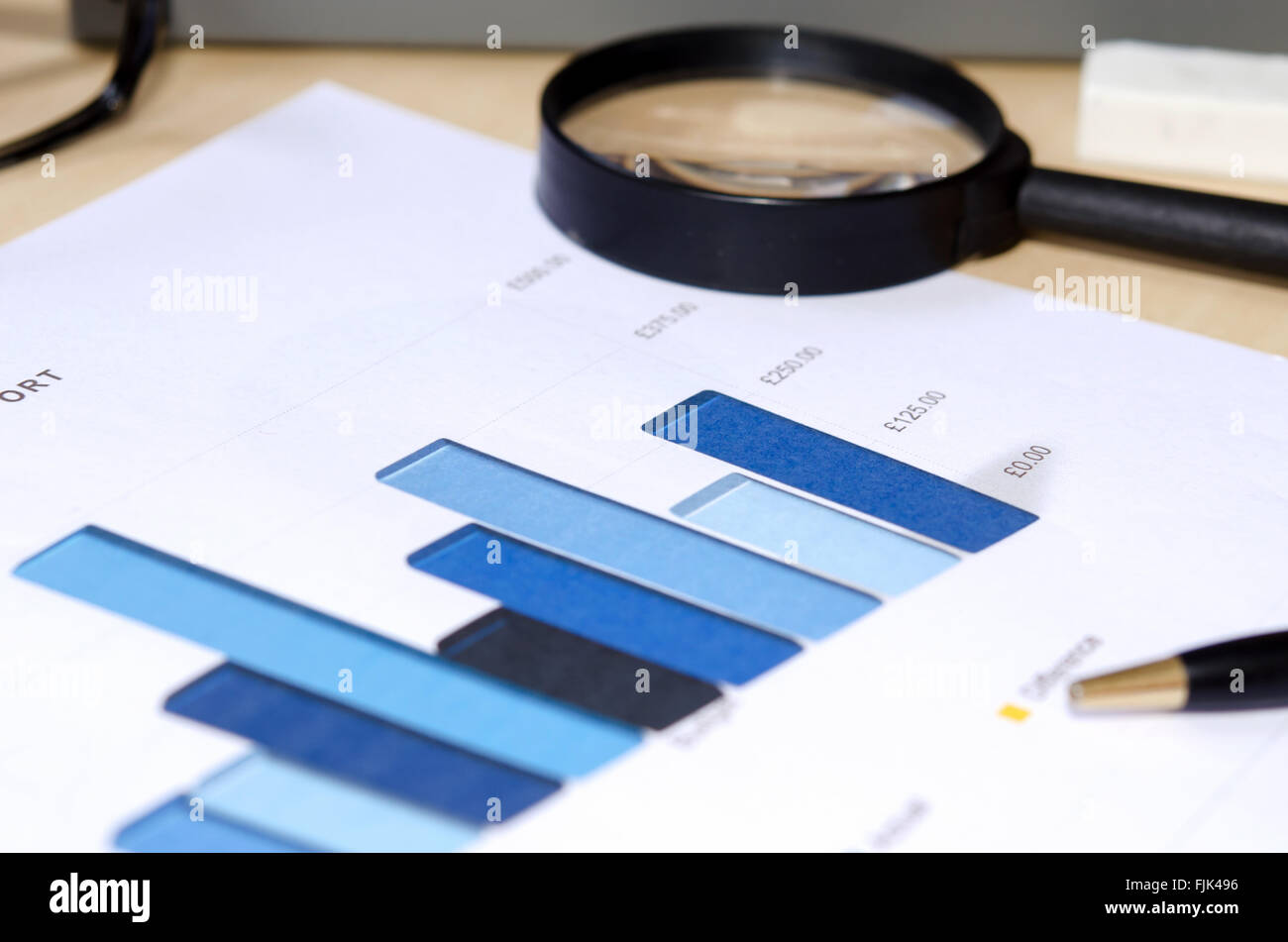 Financial graphs analysis and pen Stock Photo - Alamy