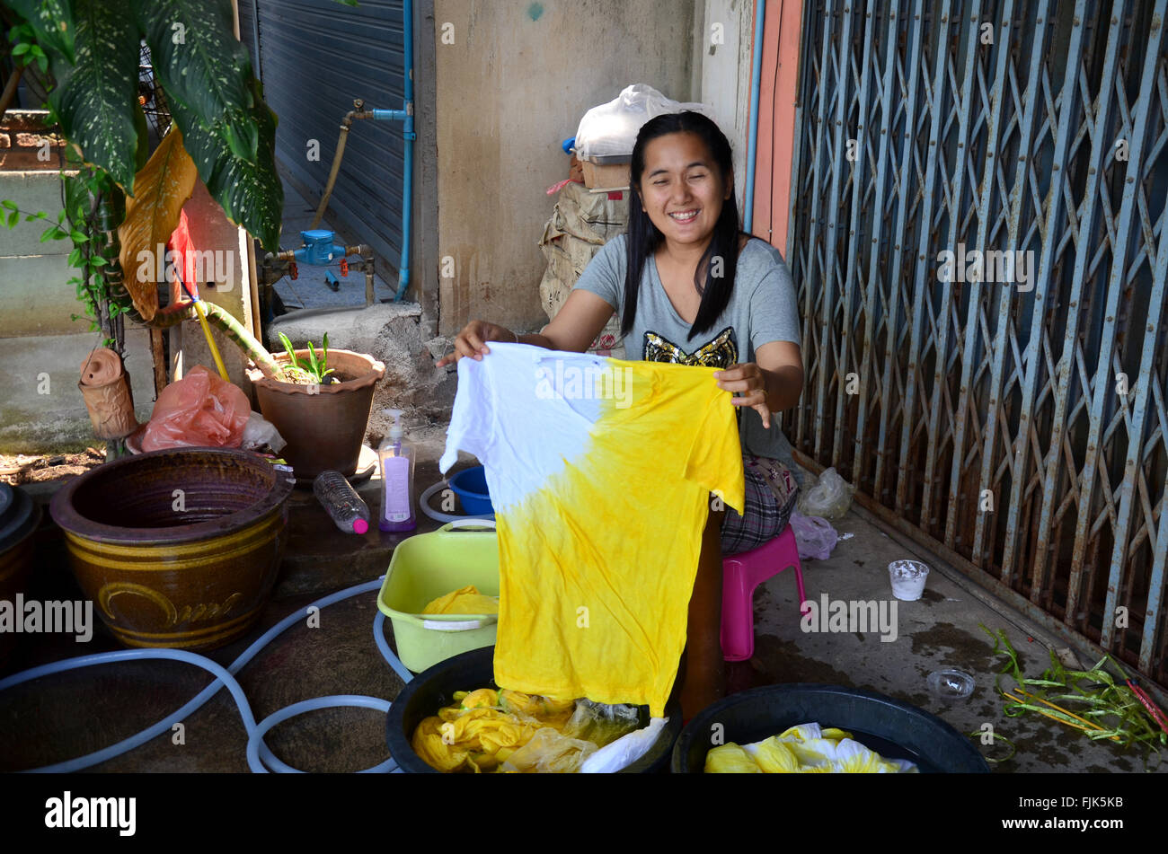 Thai women washing and clean clothes after tie batik dyeing natural ...