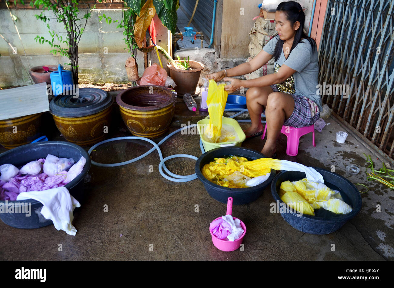 Thai women washing and clean clothes after tie batik dyeing natural ...
