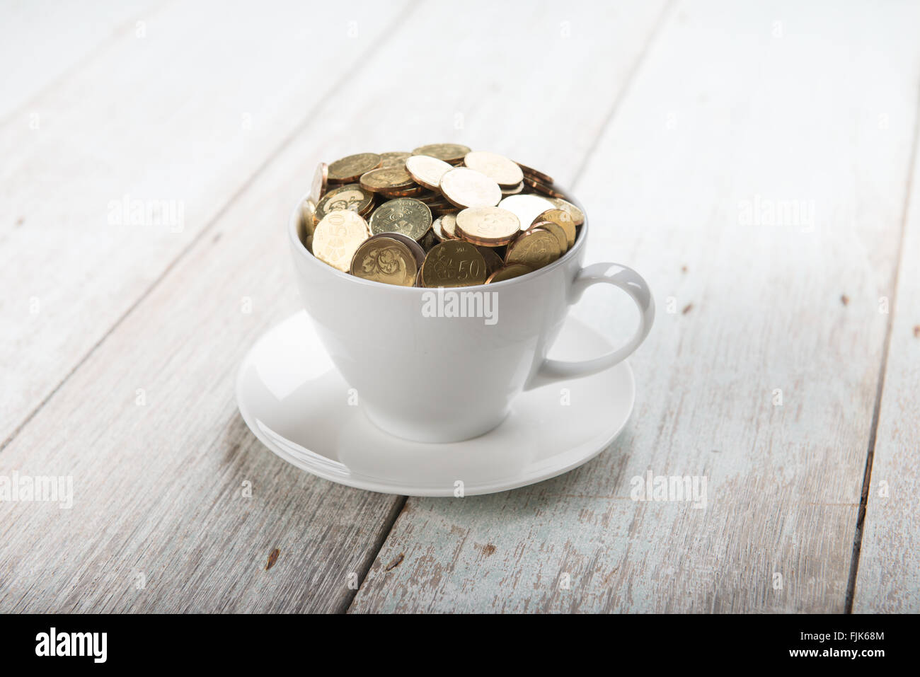cup of coffee with gold coins of malaysian ringgit Stock Photo - Alamy