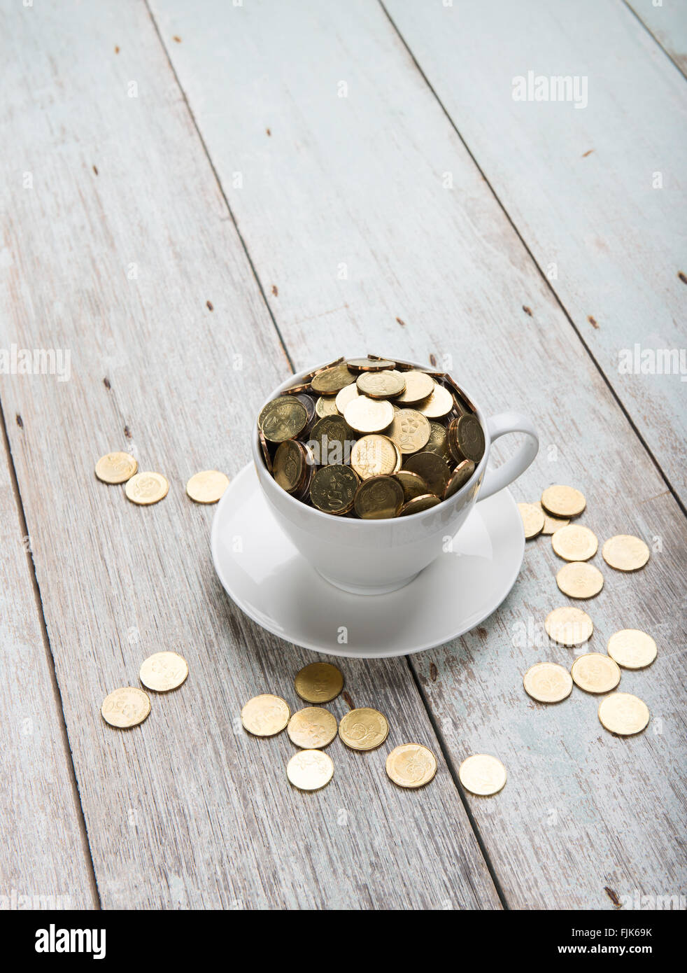 cup of coffee with gold coins of malaysian ringgit Stock Photo - Alamy