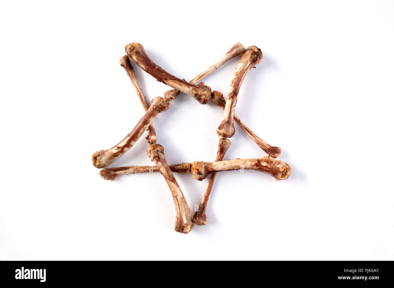 Chicken bone inverted pentagram on white background Stock Photo - Alamy