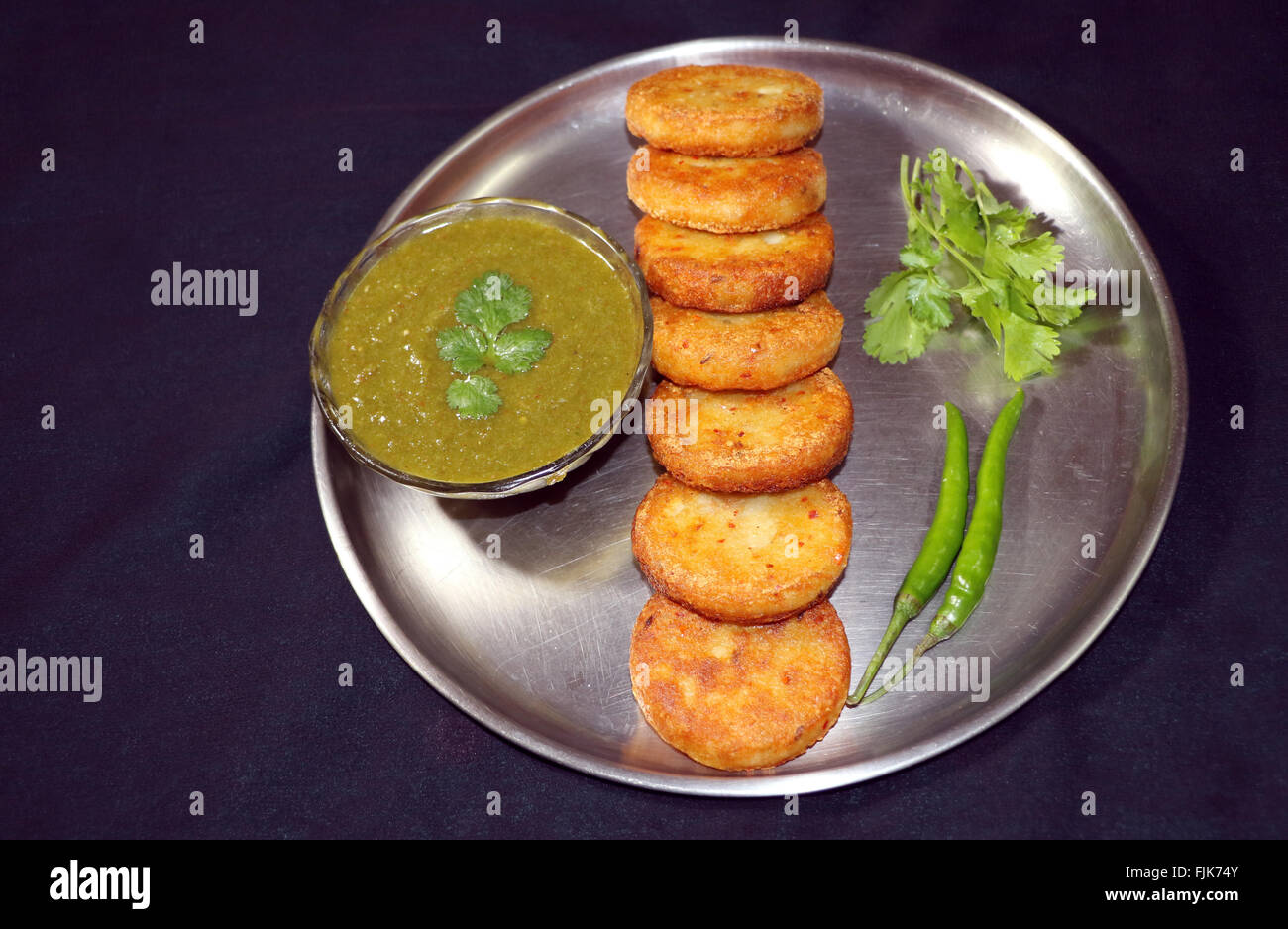 Aloo Tikki or Fried Potato Patties; a popular Indian snack served with ...