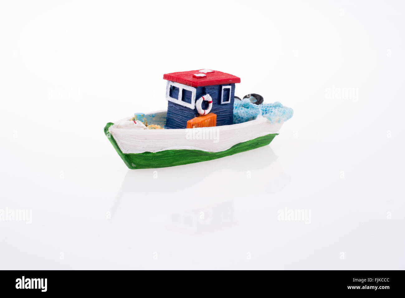 Small Ship model on a white background Stock Photo - Alamy