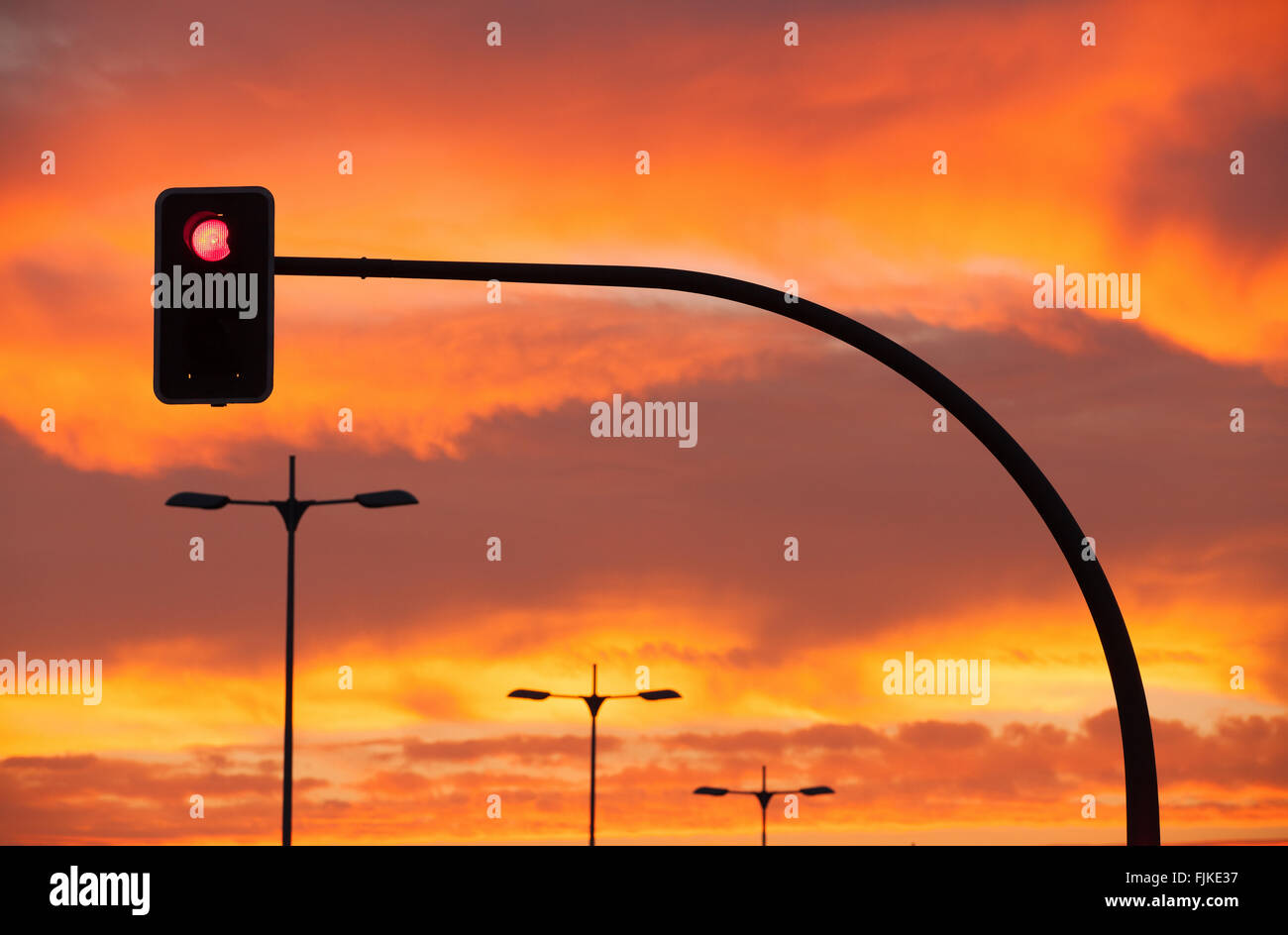 Red traffic light in a dramatic red sunset Stock Photo - Alamy