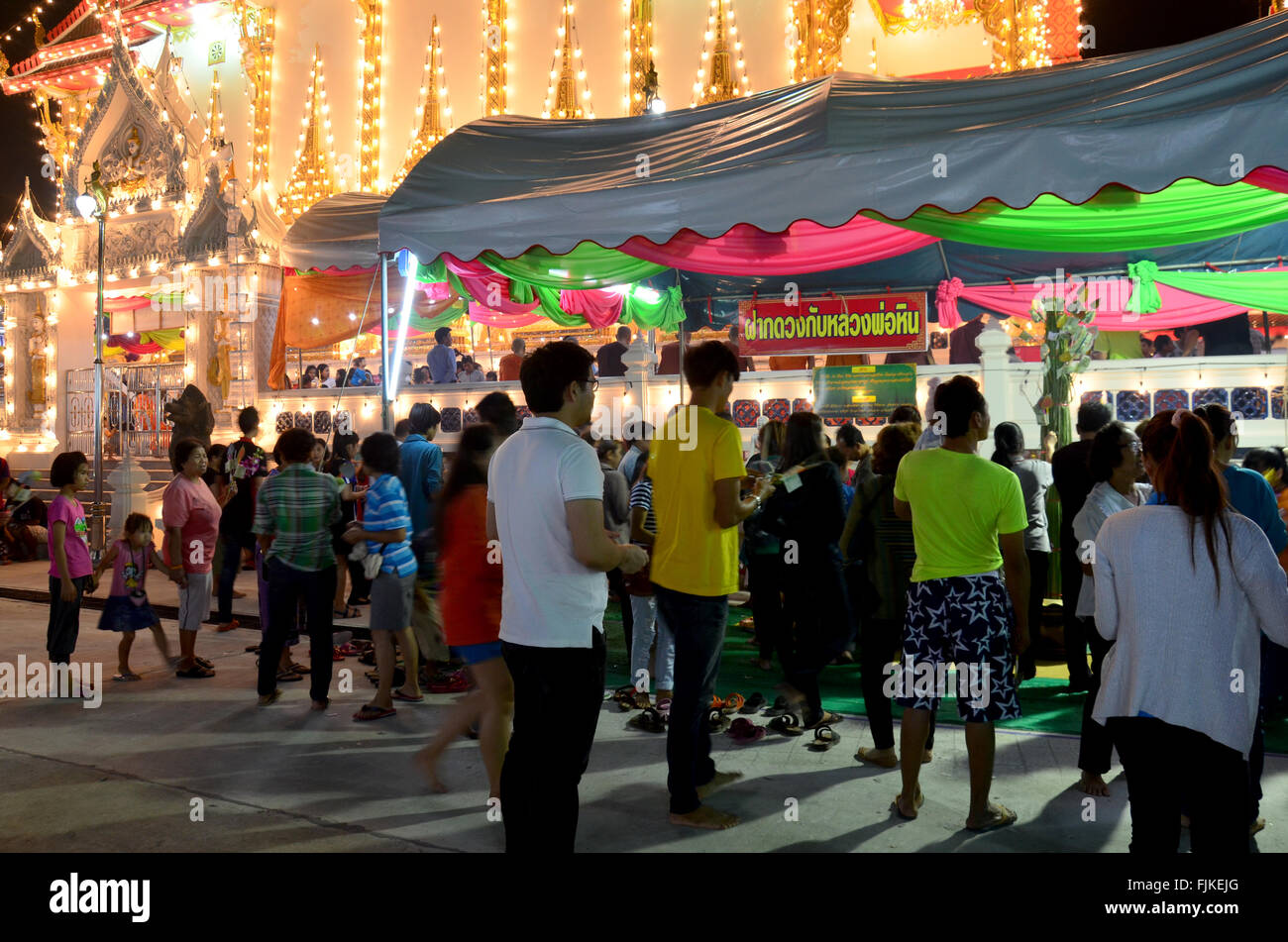 People join Kathin merit ceremony and praying with buddha statue at Wat ...