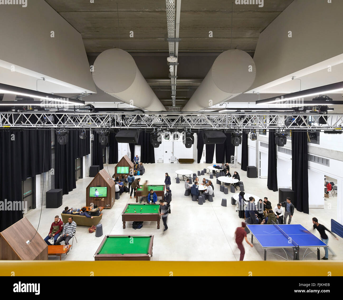 Elevated view into student lounge with pool and ping pong tables. MMU ...